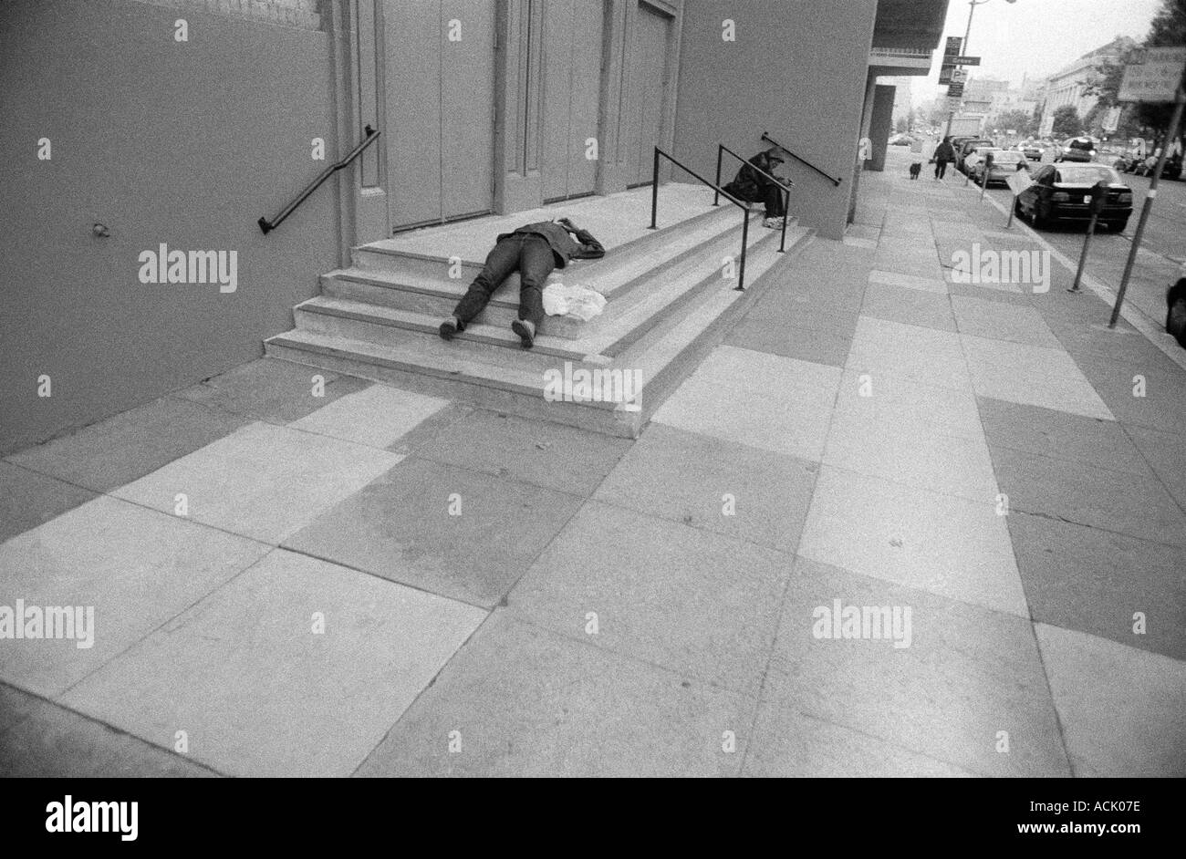 Homeless man sleeping on steps hi-res stock photography and images - Alamy