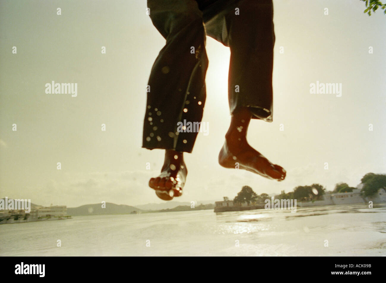 A person s legs jumping into water Stock Photo - Alamy