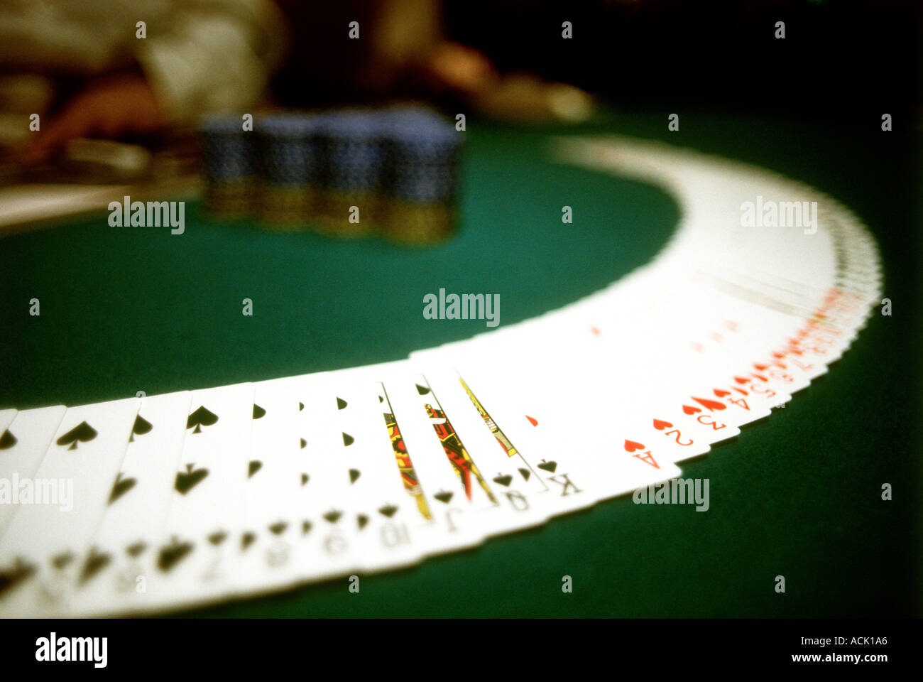 deck of cards on a poker table Stock Photo - Alamy