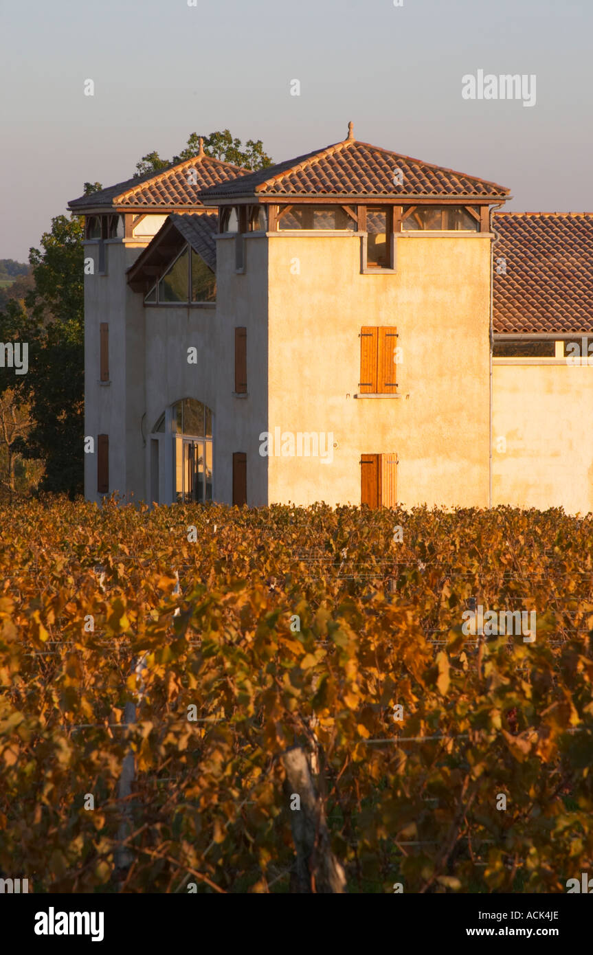 The newly constructed winery building seen over the green yellow golden ...