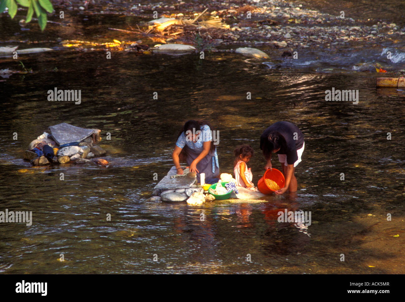 Girl washing clothes in river hi-res stock photography and images - Alamy