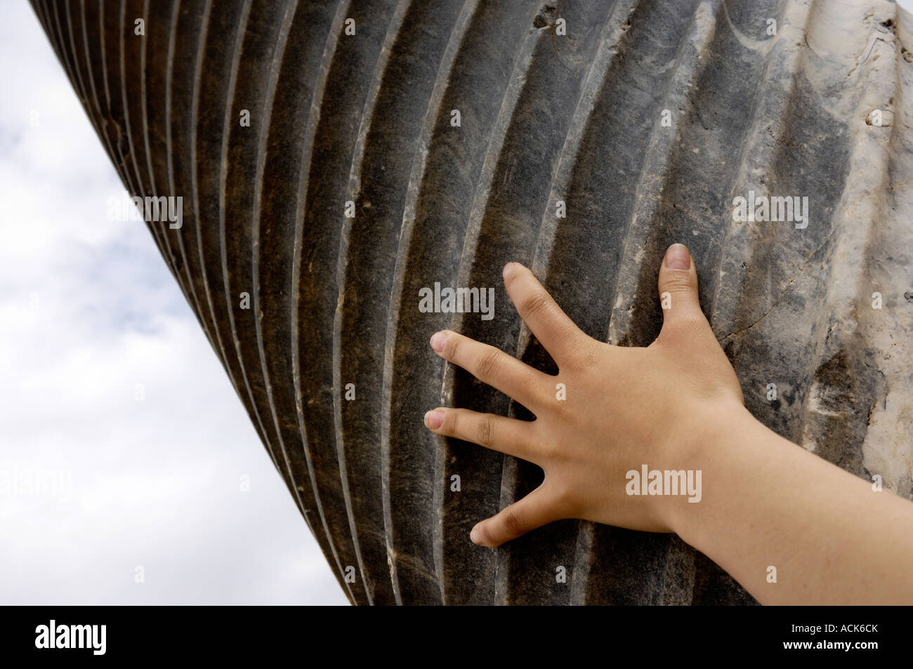 Female hand touching ancient column Archaeological Site of Kourion in ...