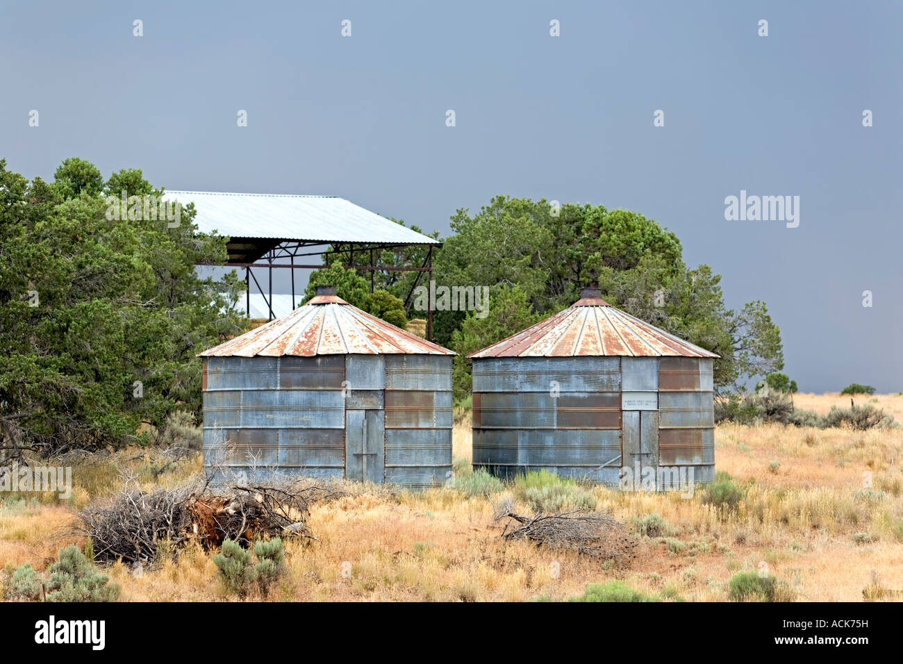 Farm grain storage old steel southern Utah Stock Photo - Alamy