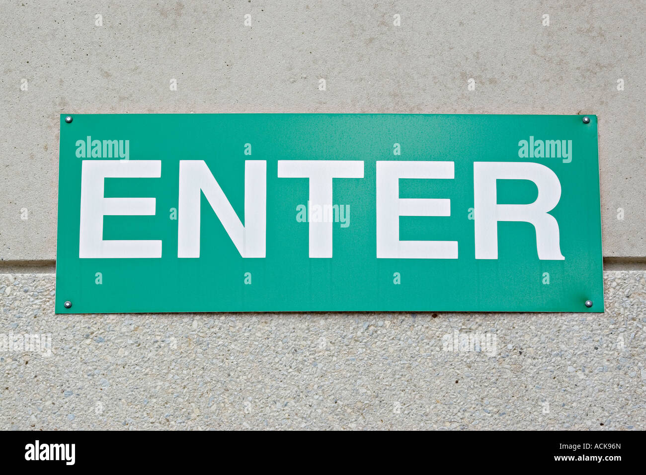ENTER sign on concrete wall Stock Photo - Alamy