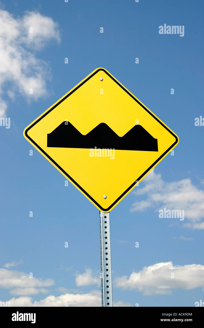 Bumps in road caution sign Stock Photo - Alamy