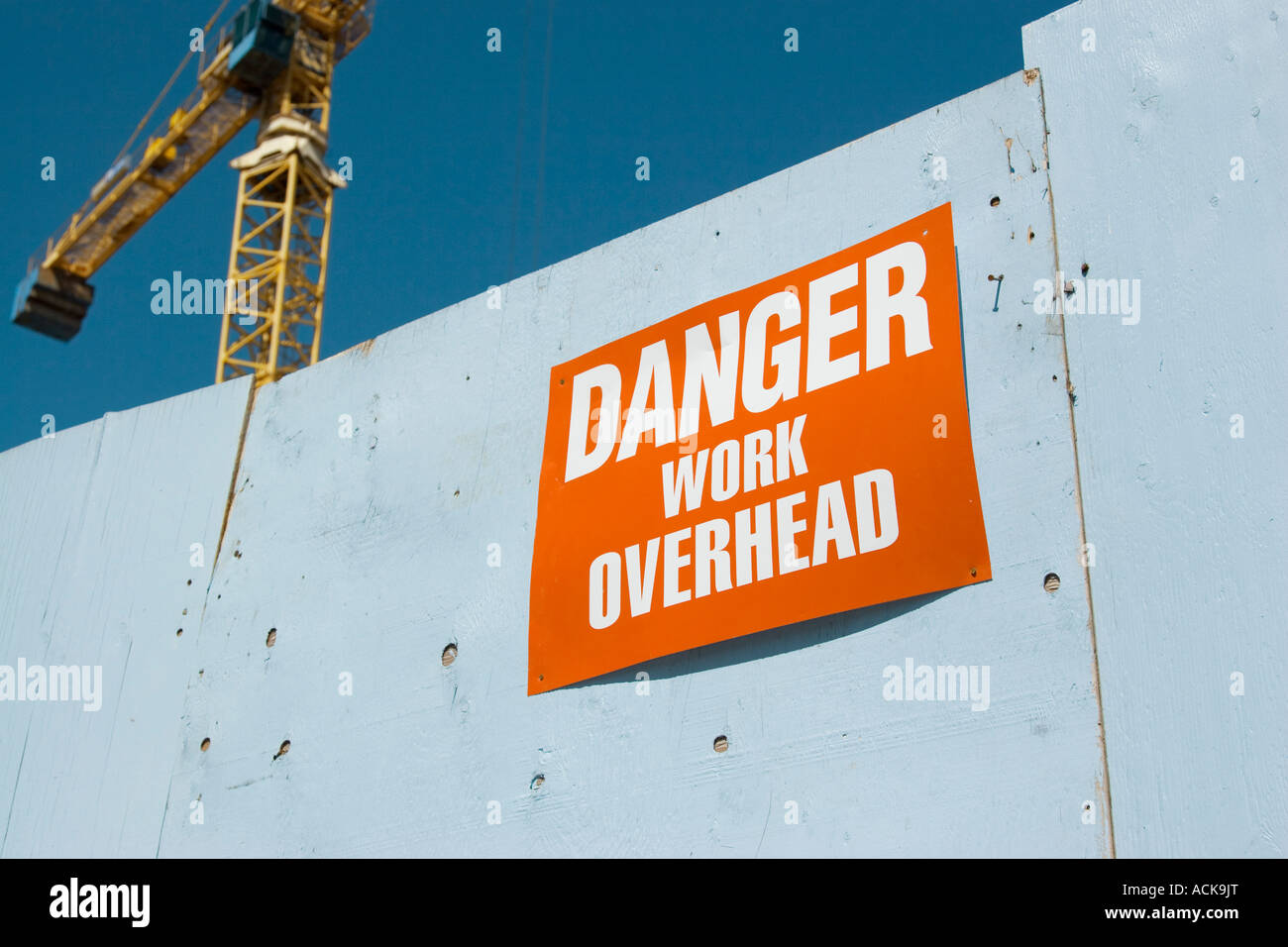 Danger - Work Overhead sign at construction site Stock Photo - Alamy