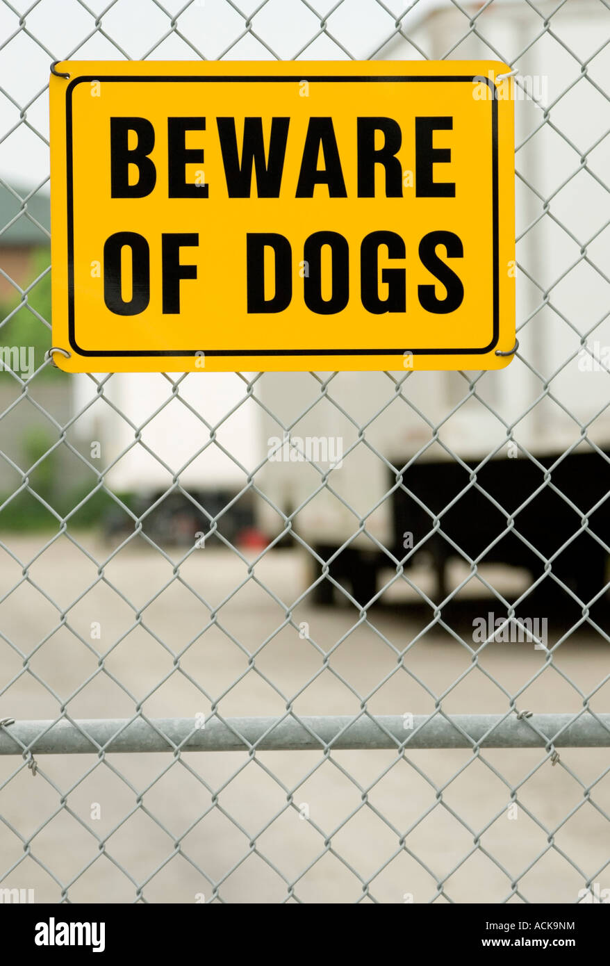 Beware of Dogs sign on chain link fence Stock Photo - Alamy