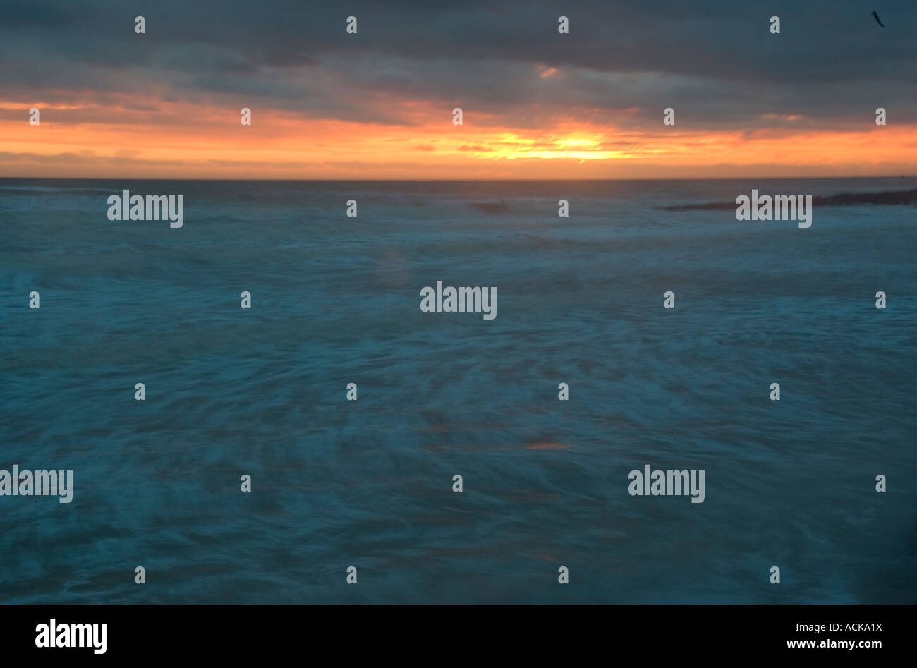 europe uk england english channel waves at sunset Stock Photo - Alamy