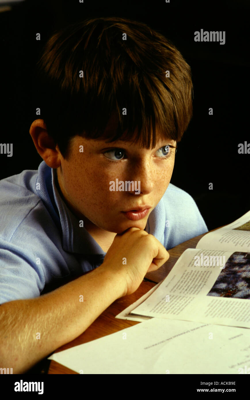 Boy with homework Stock Photo - Alamy