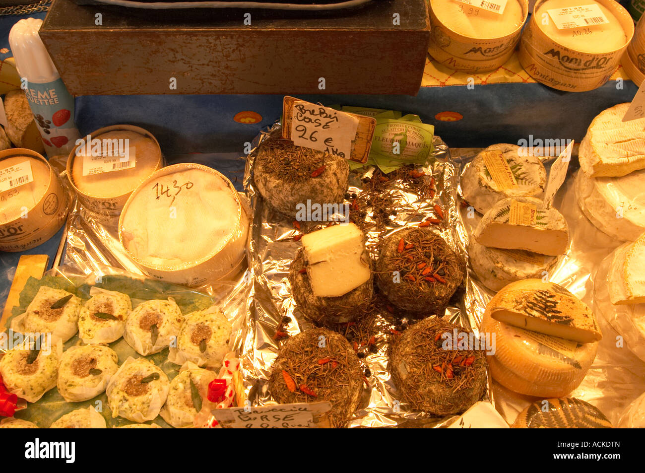 Cheese display at a traditional french market Stock Photo - Alamy