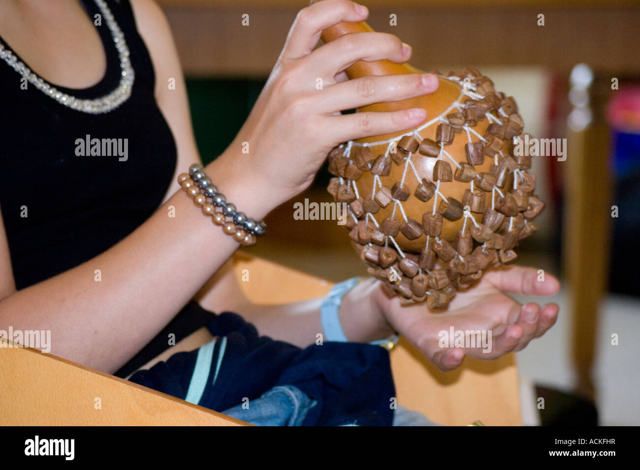Young woman holding African percussion instrument shaker rattle Stock ...