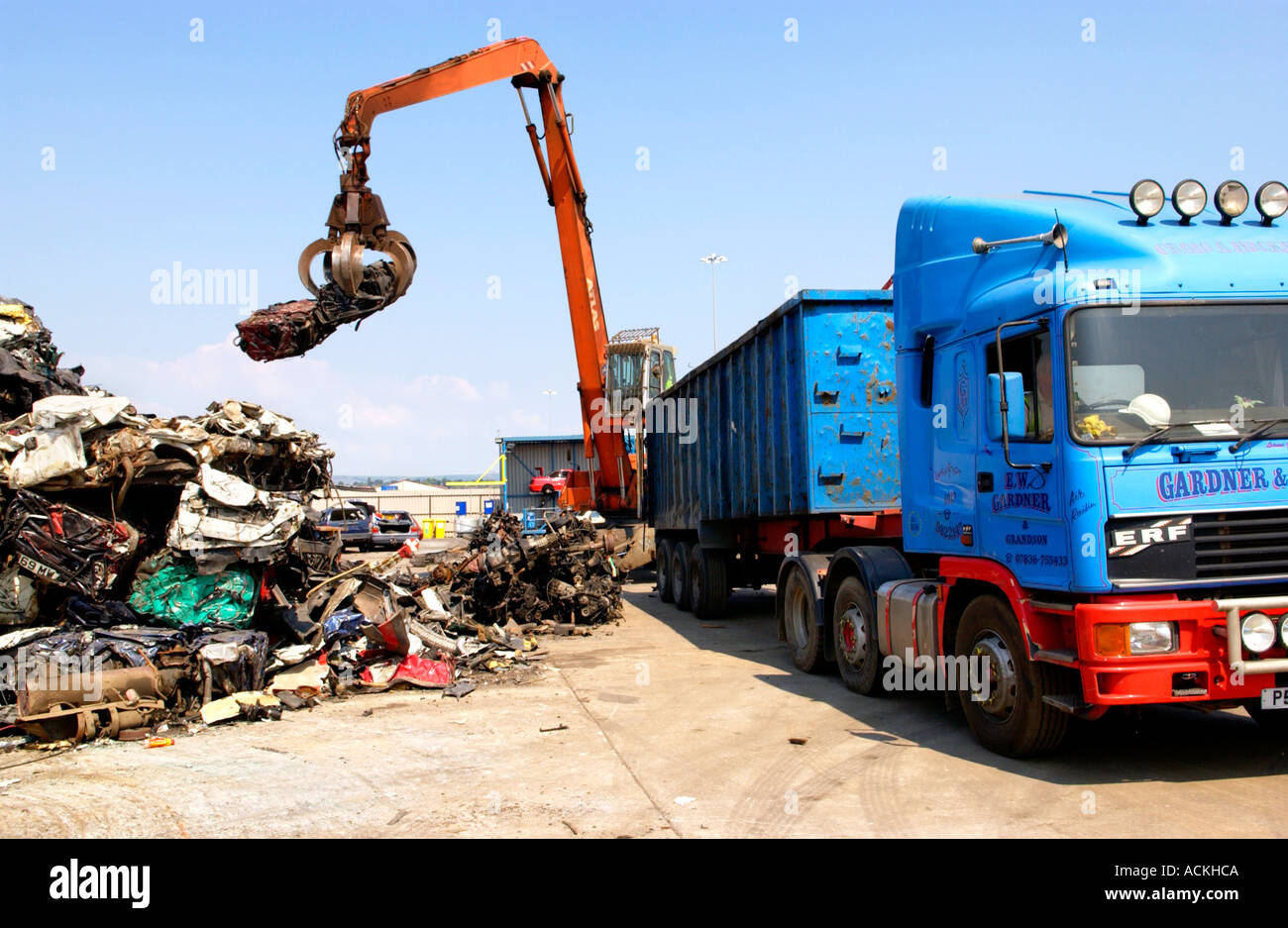 Compacted cars ready for recycling in scrapyard at Newport Docks South ...