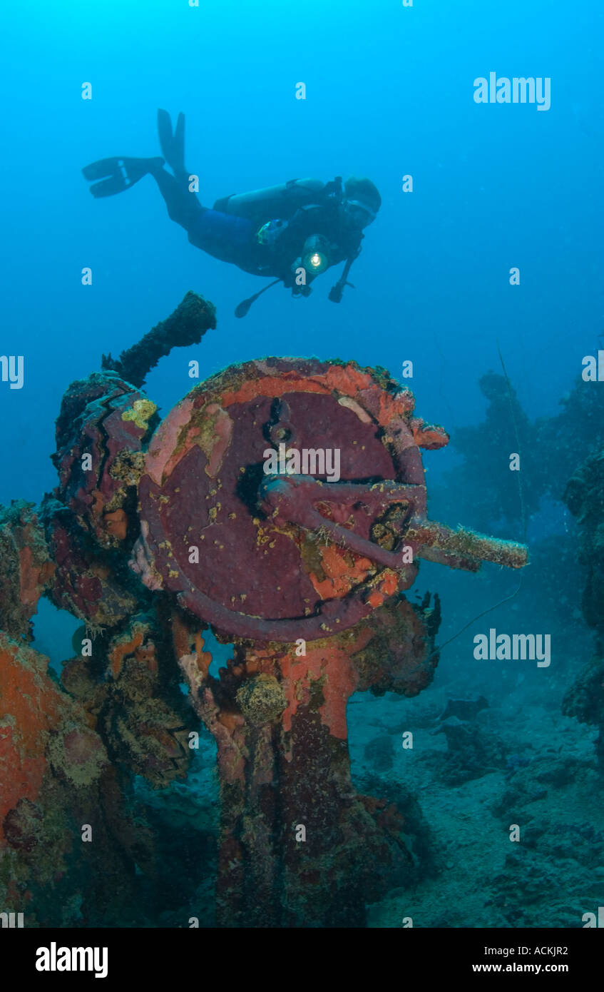 Scuba diver and engine order telegraph underwater on shipwreck Shinkoku ...
