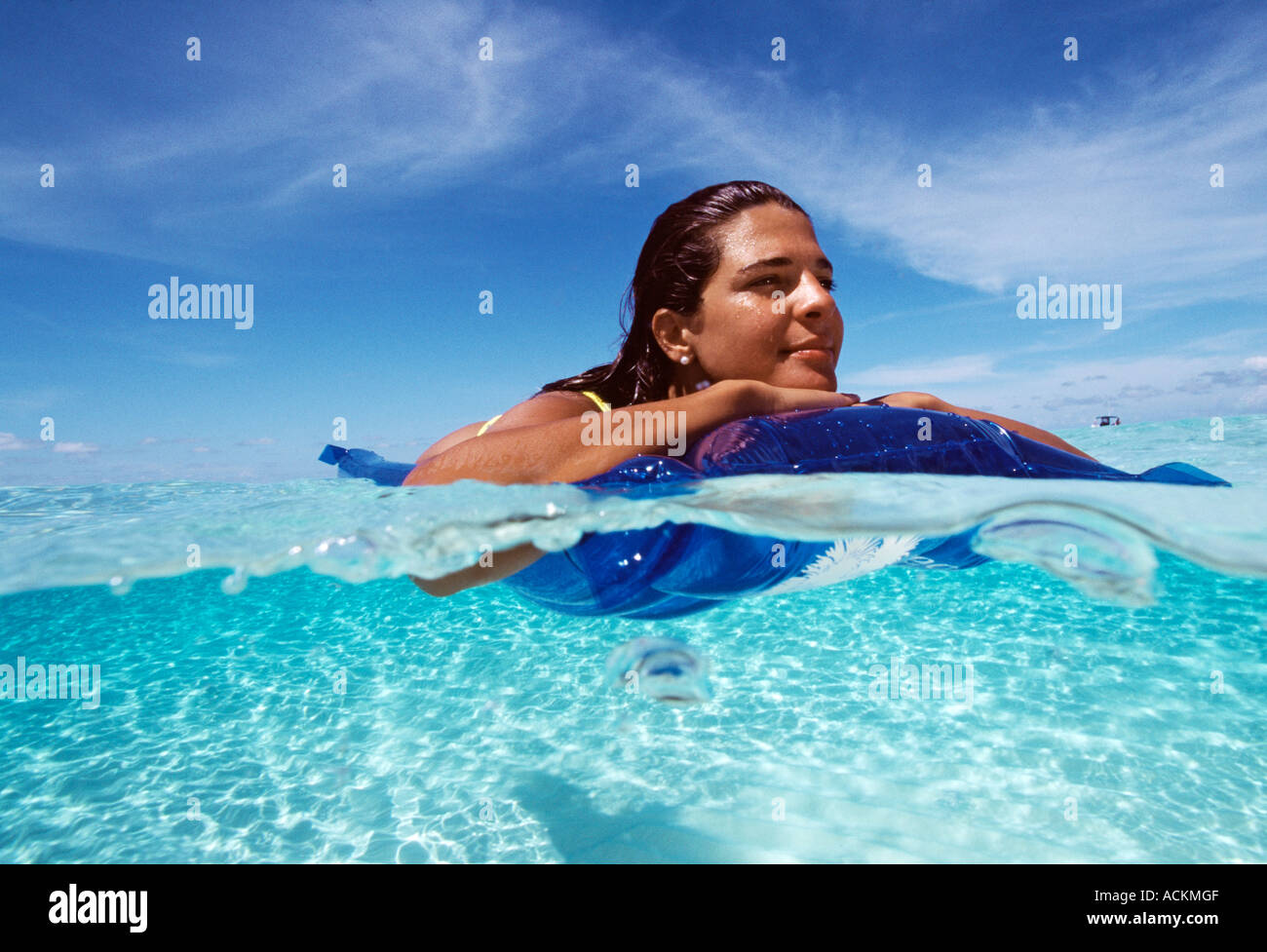 Grand Cayman Cayman Islands Sandbar under over woman floating in clear ...