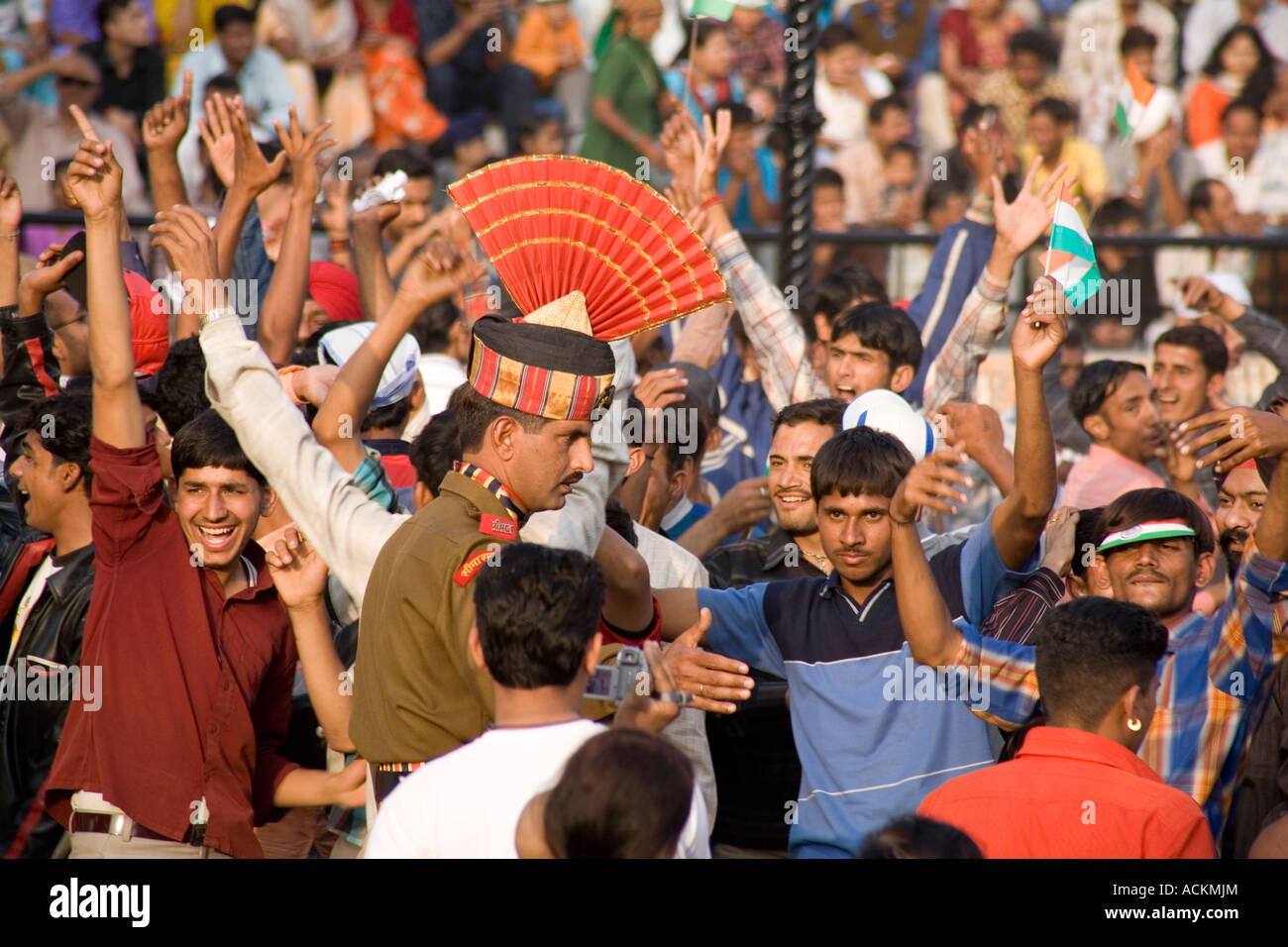 Border guard controls male crowd at Wagah Gate, India-Pakistan border ...