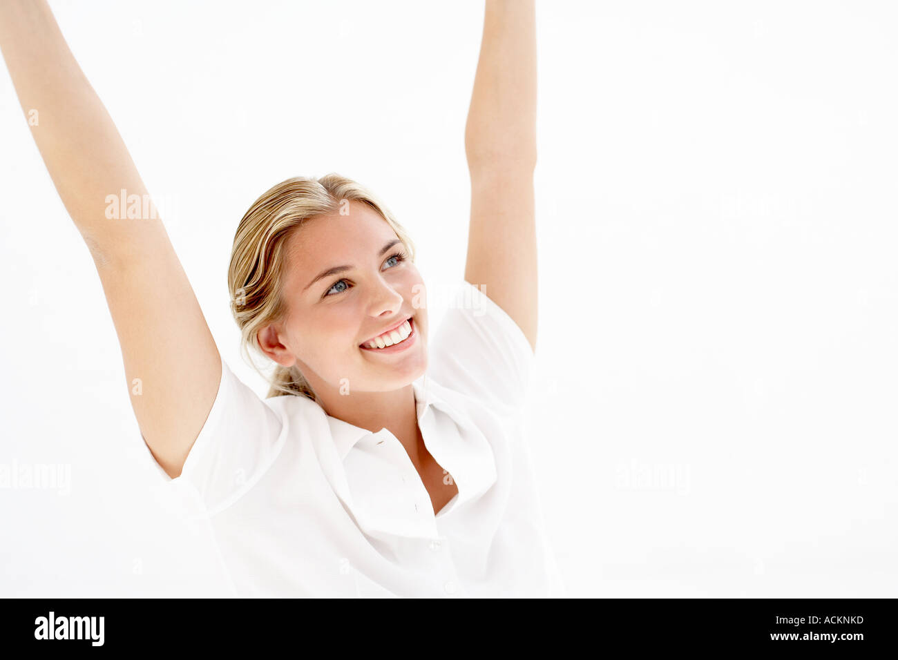 A young woman looking up smiling Stock Photo - Alamy