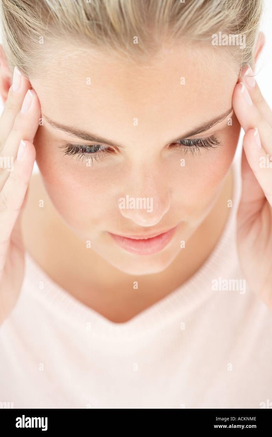 A young woman looking down close up Stock Photo - Alamy