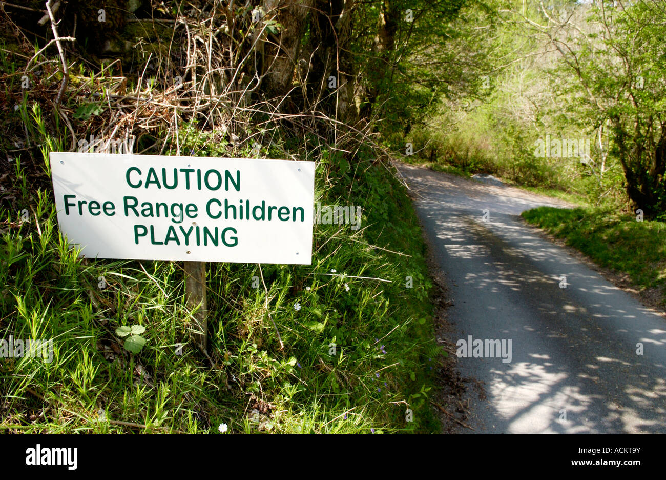 CAUTION FREE RANGE CHILDREN PLAYING warning sign on country road in ...
