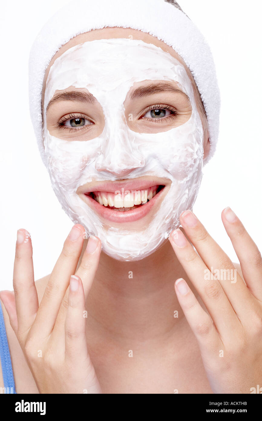 Young woman with cream on face Stock Photo - Alamy