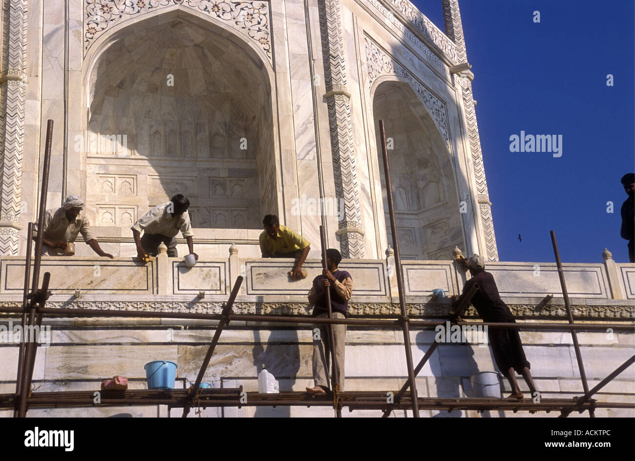 Workers cleaning the plinth of the Taj Mahal Agra Uttar Pradesh India ...