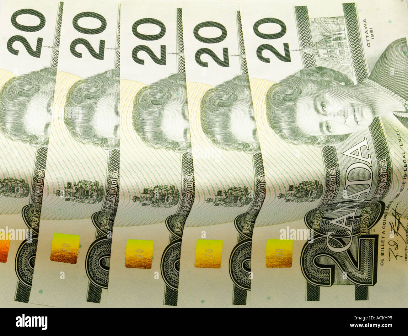 Twenty Canadian dollar bills spread out in a fan pattern Stock Photo ...