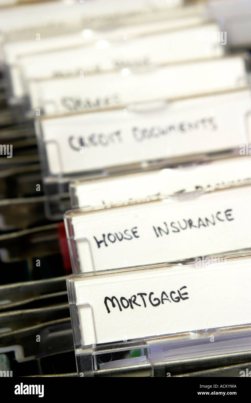 Detail of a filing cabinet with tabs labelled for mortgage documents ...