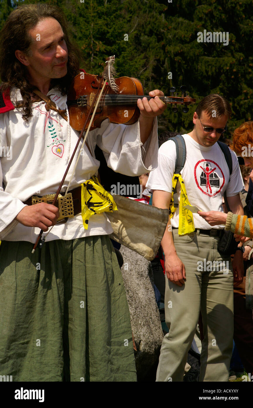 Musician dressed in traditional Slovak folk costume, holding violin ...