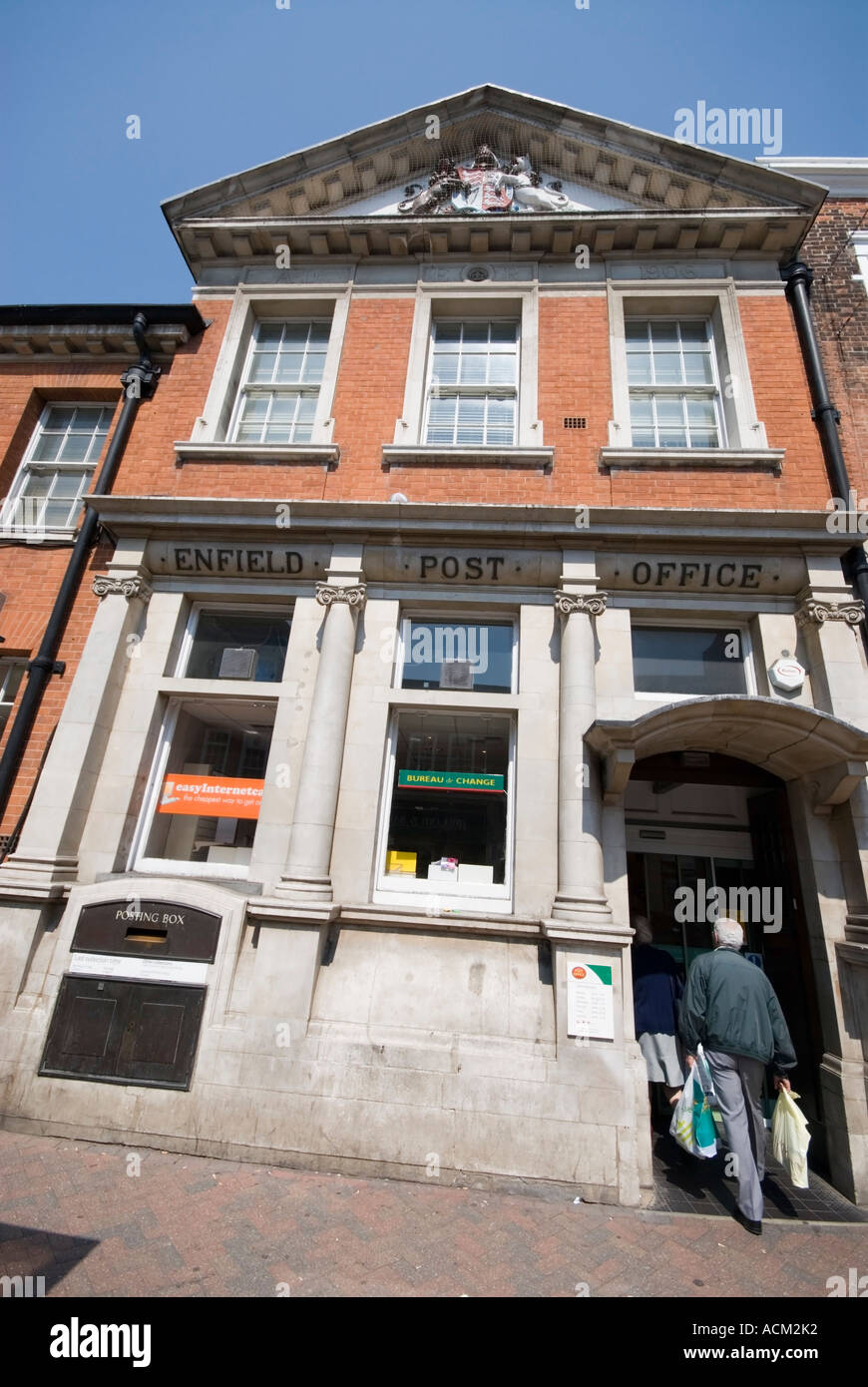 Customer going into main post office building in Enfield North London ...