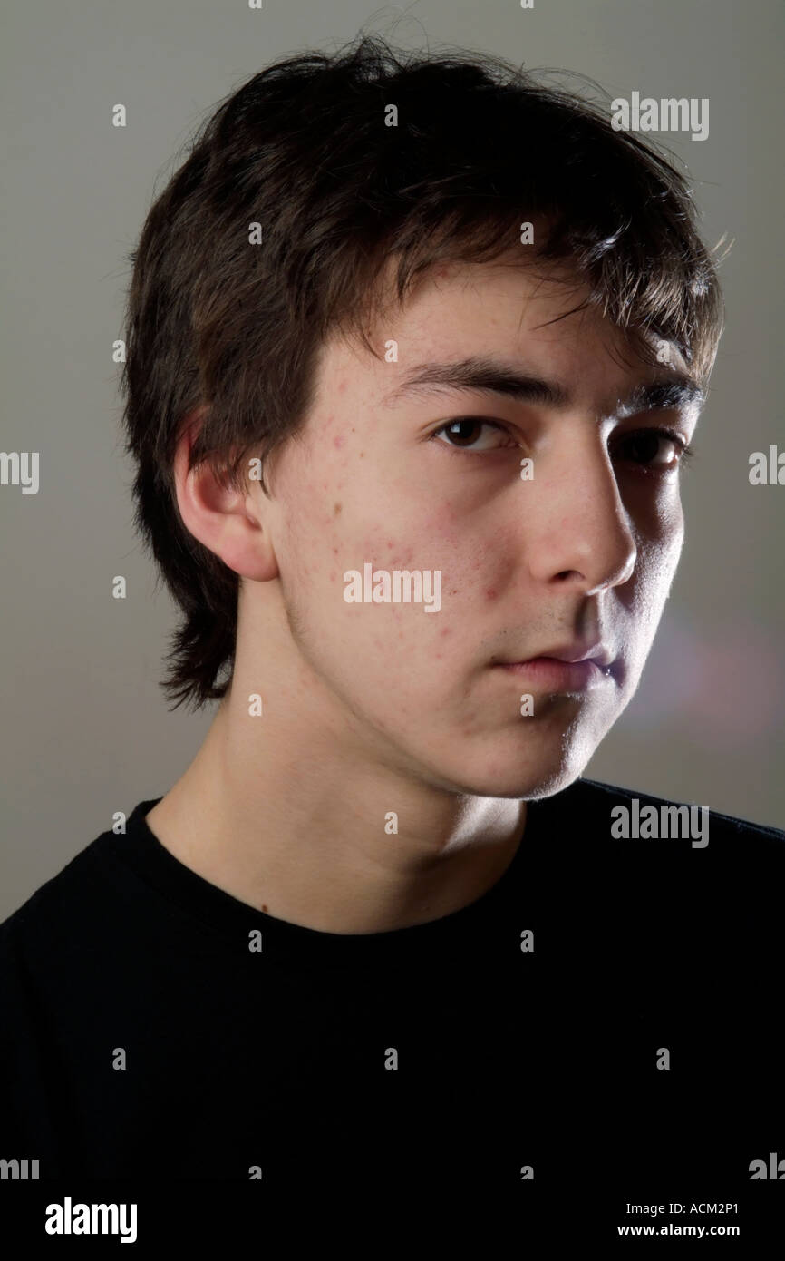 Teenage boy looking disdainfully at the viewer Stock Photo - Alamy
