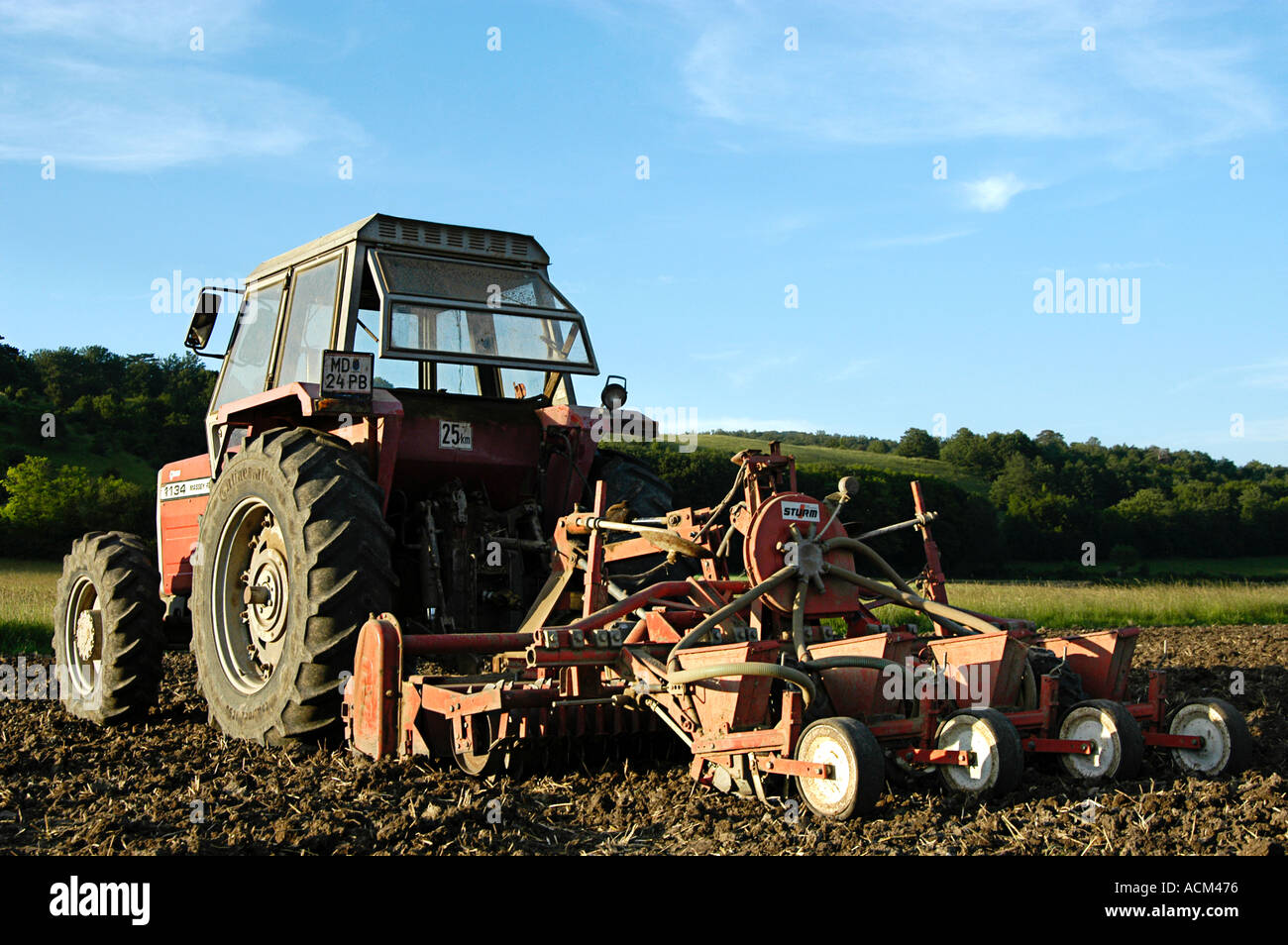 A Tractor plowing a field Tractor with a plow Stock Photo - Alamy