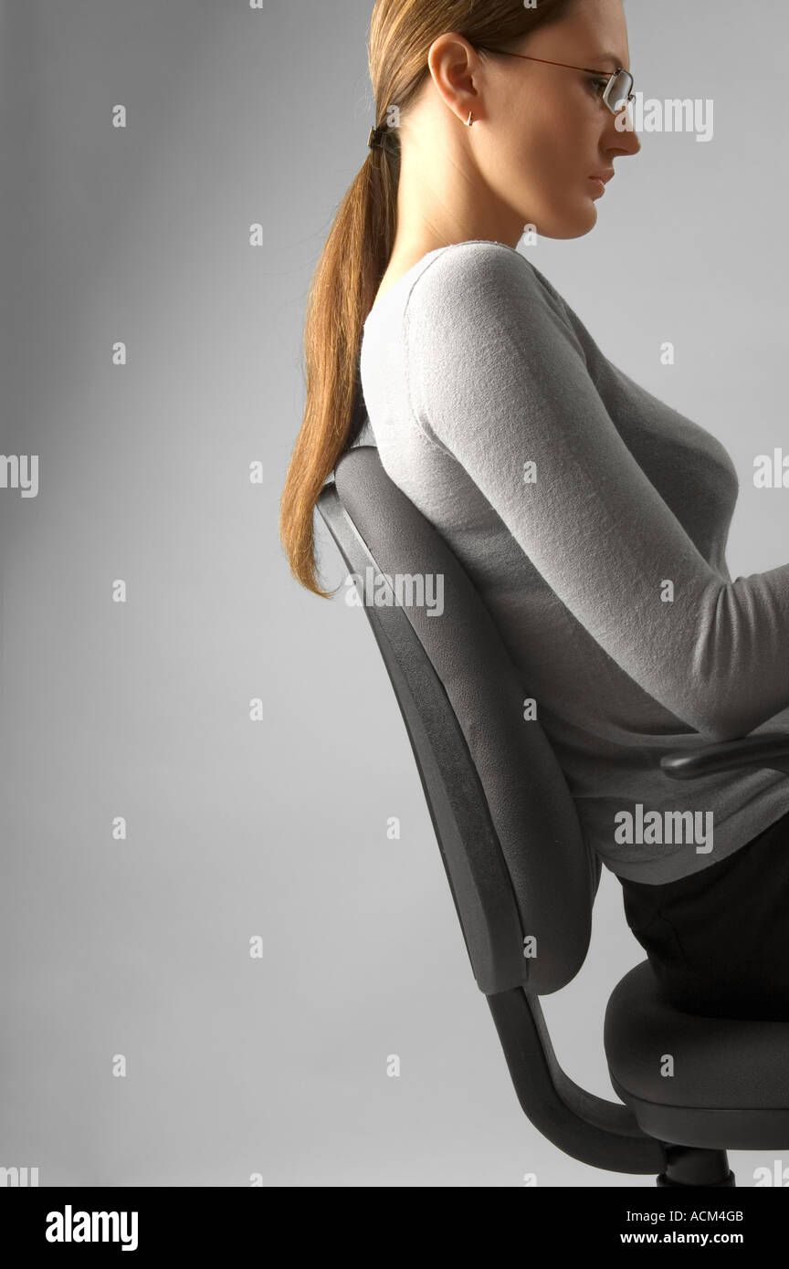Woman sitting in the chair Stock Photo - Alamy