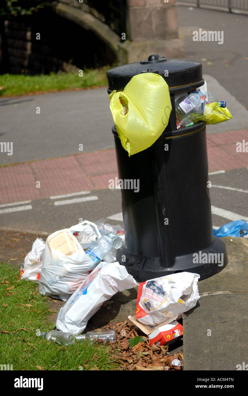 Over flowing rubbish bin Stock Photo - Alamy