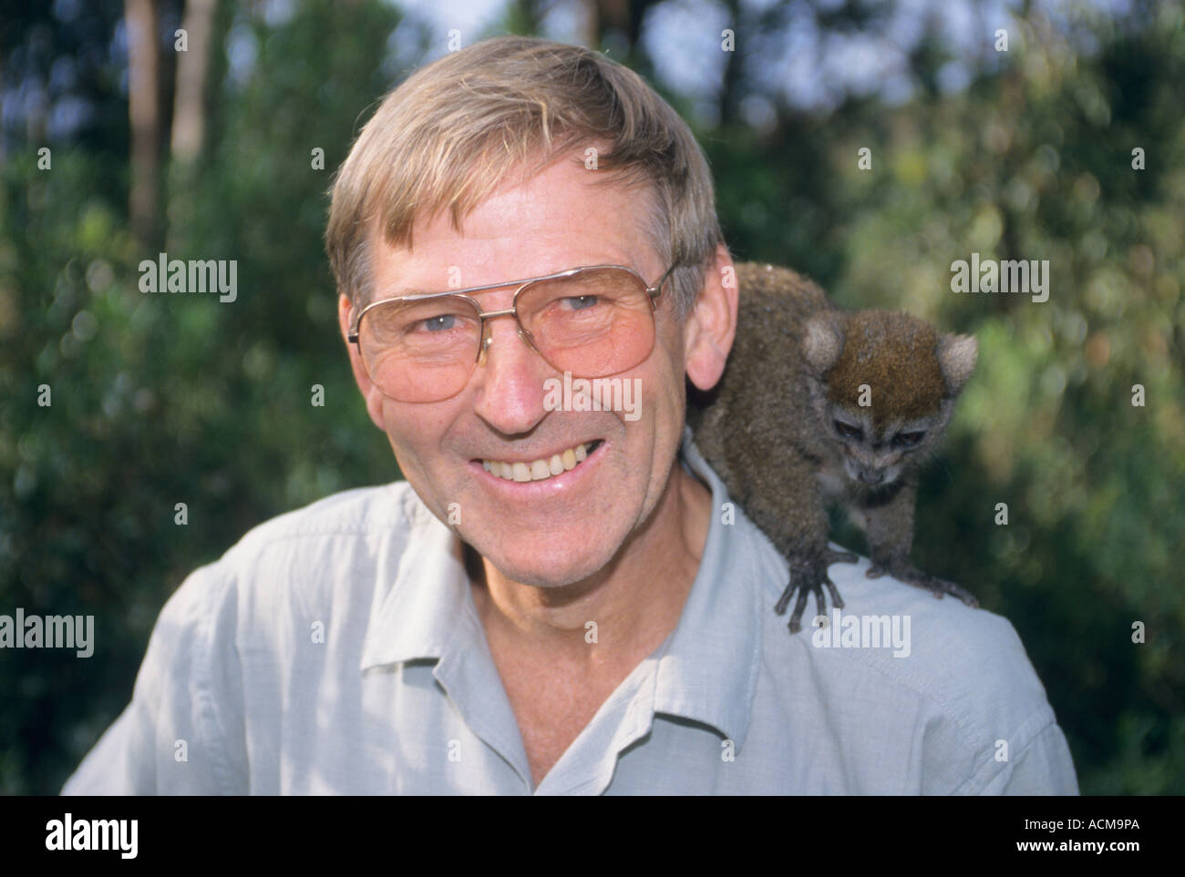 Madagascar, man with captive Bamboo Lemur Stock Photo - Alamy