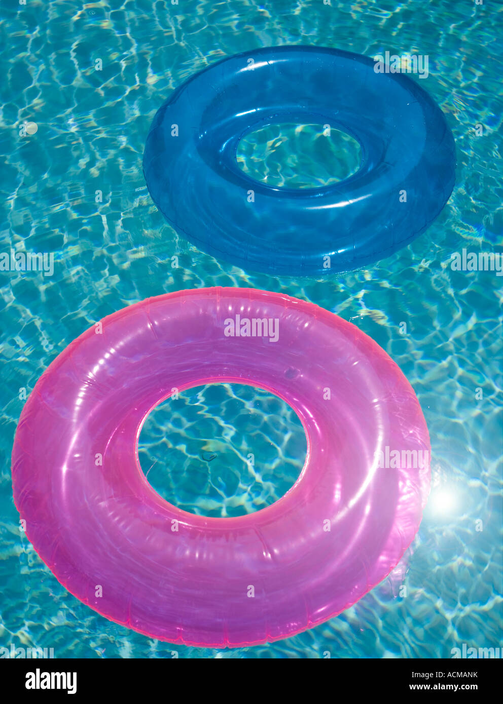 Inflatable rings in a backyard pool Stock Photo - Alamy