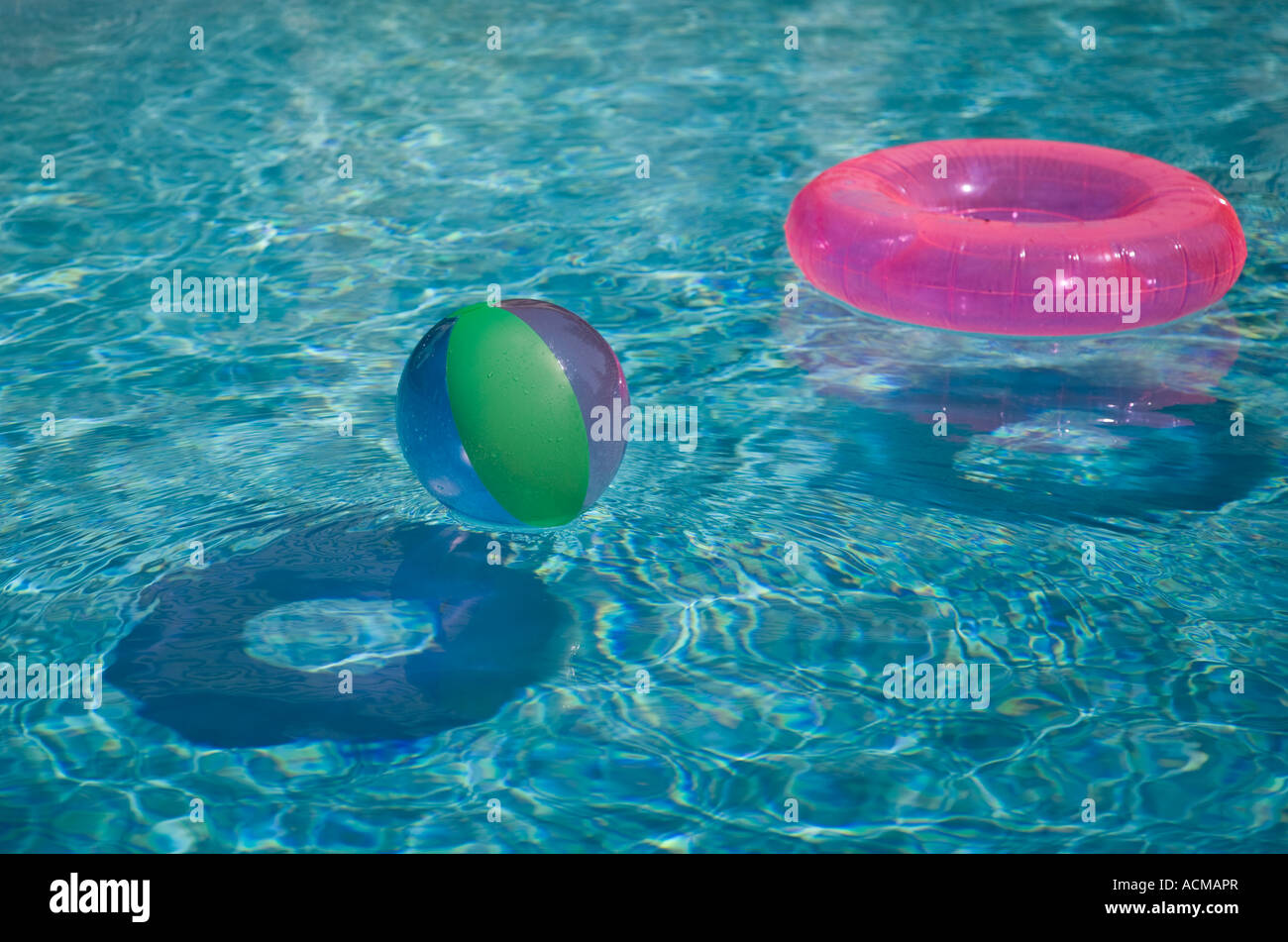 Inflatable toys in a backyard pool Stock Photo - Alamy
