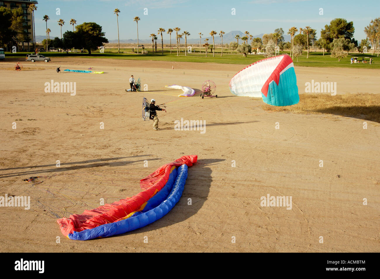 a powered paraglider pilot perpares to take off at the 4th annual ...