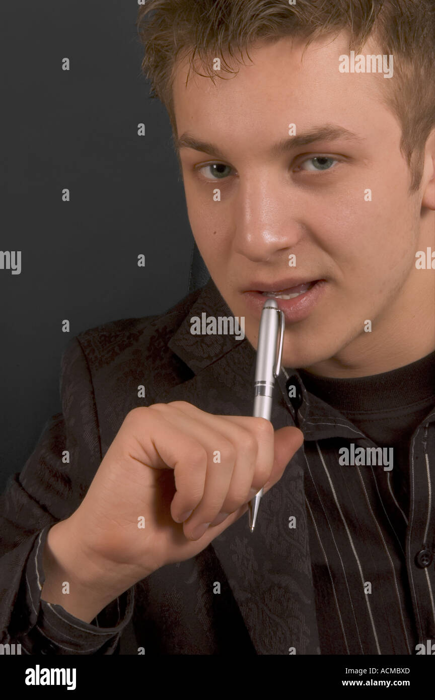 Man in black with pen Stock Photo - Alamy