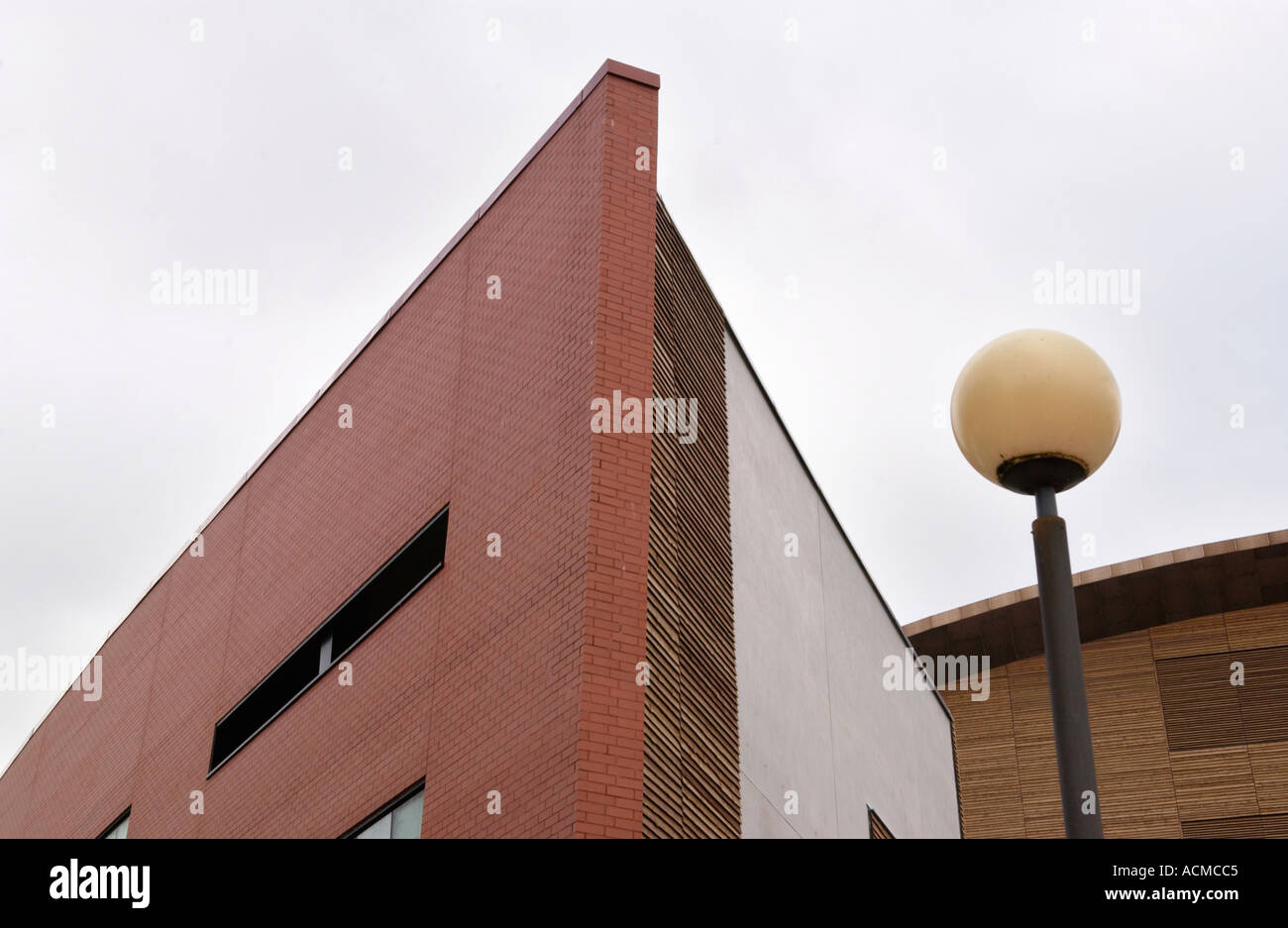 Red brick and timber cladding exterior details at the rear of the Wales ...