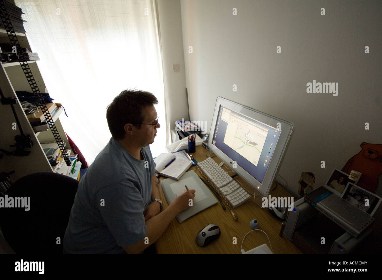 man working on a pc in home office Stock Photo - Alamy
