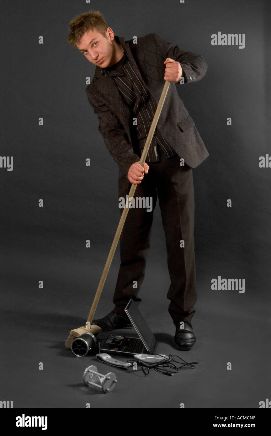 Man with a broom hi-res stock photography and images - Alamy