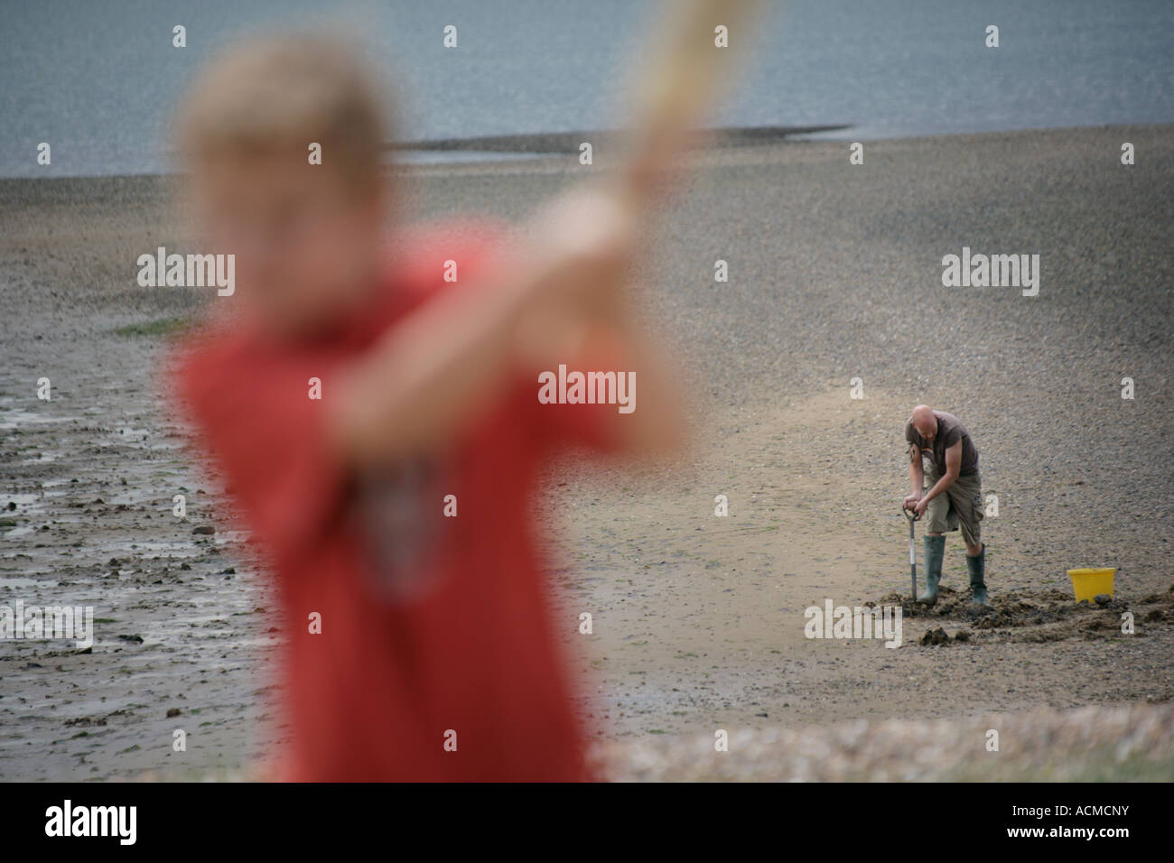 Man digging for worms on the beach hi-res stock photography and images ...