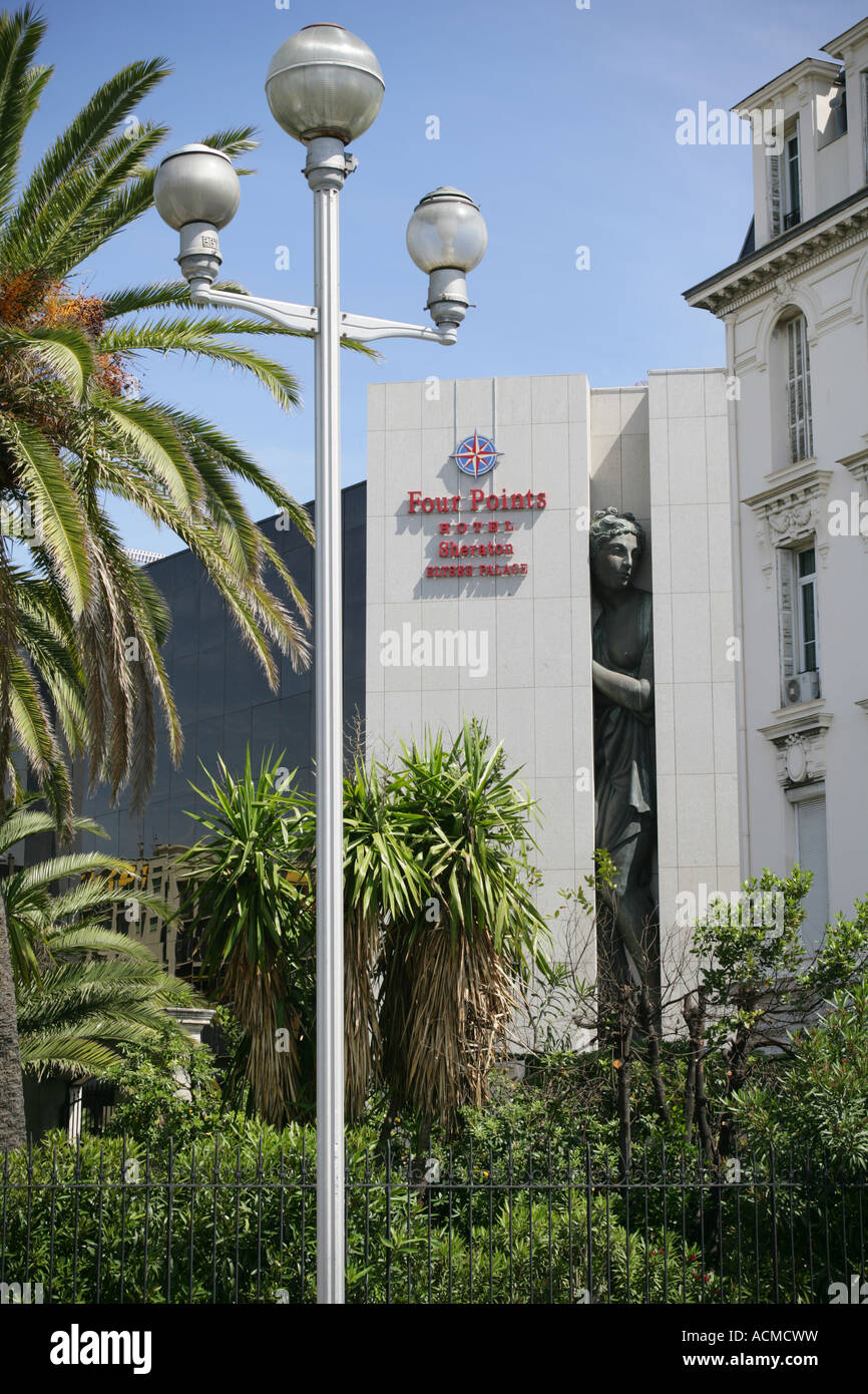 Giant statue of a female figure in the greco- roman style on the facade ...