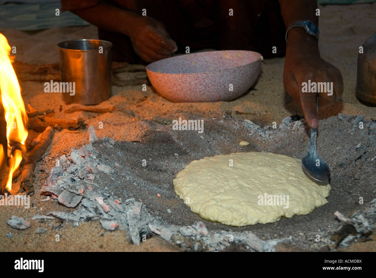 Tuareg bread is baked directly in the sand under the fire It is washed ...