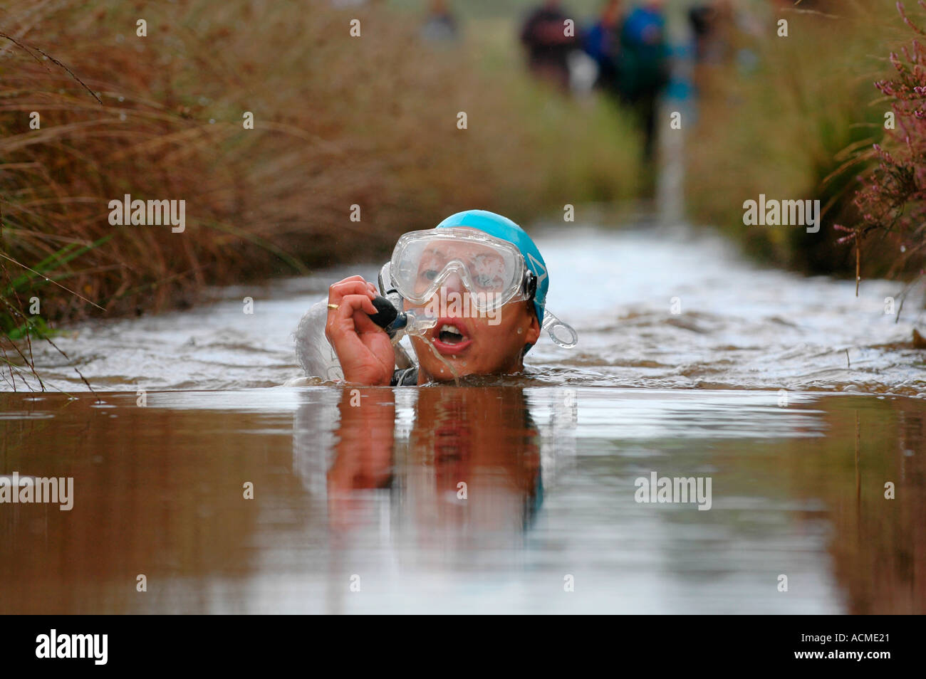 Competitor in the annual World Bog Snorkeling Championships at ...