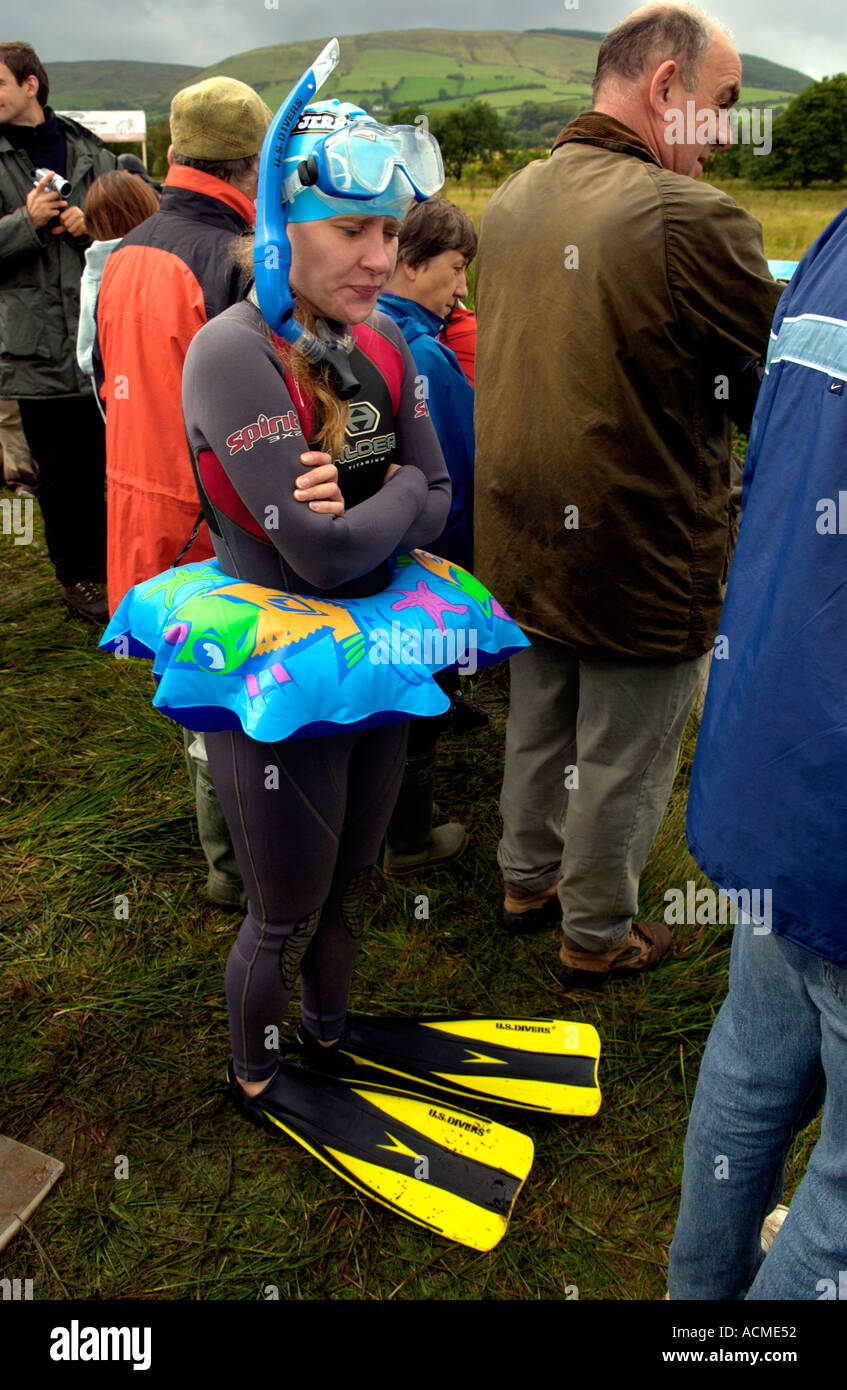 Competitor wearing child's rubber ring in the annual World Bog ...