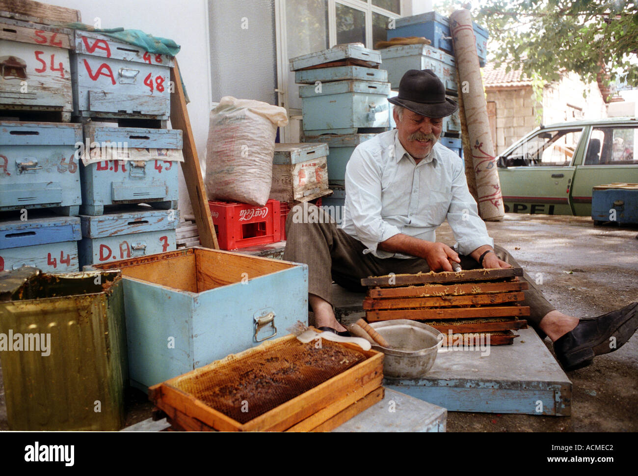 Men in small rural Turkish Village in South Western Turkey emptying and ...