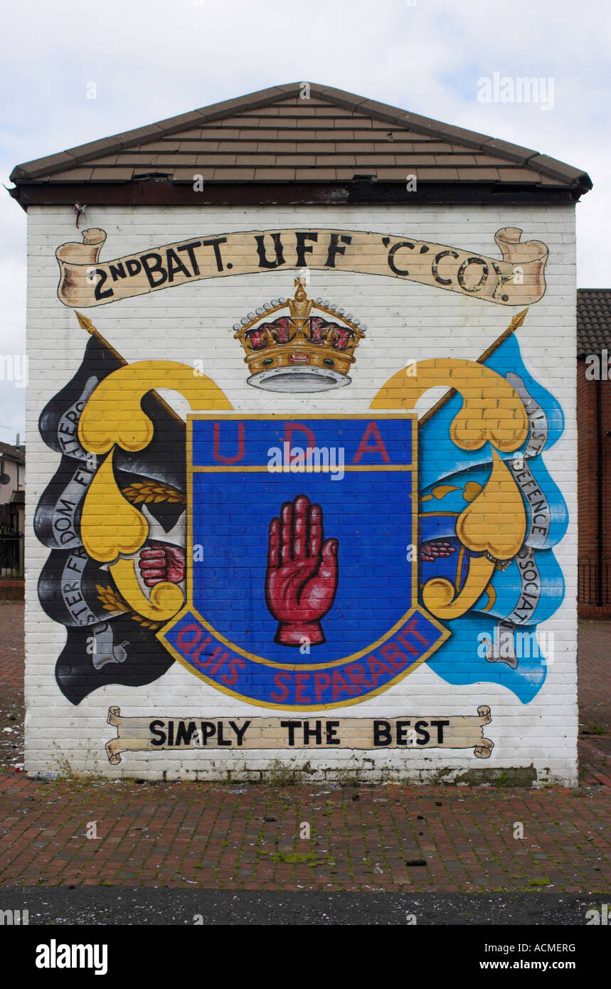 Mural with UDA emblem and UDA and UFF flags Shankill Road Belfast ...