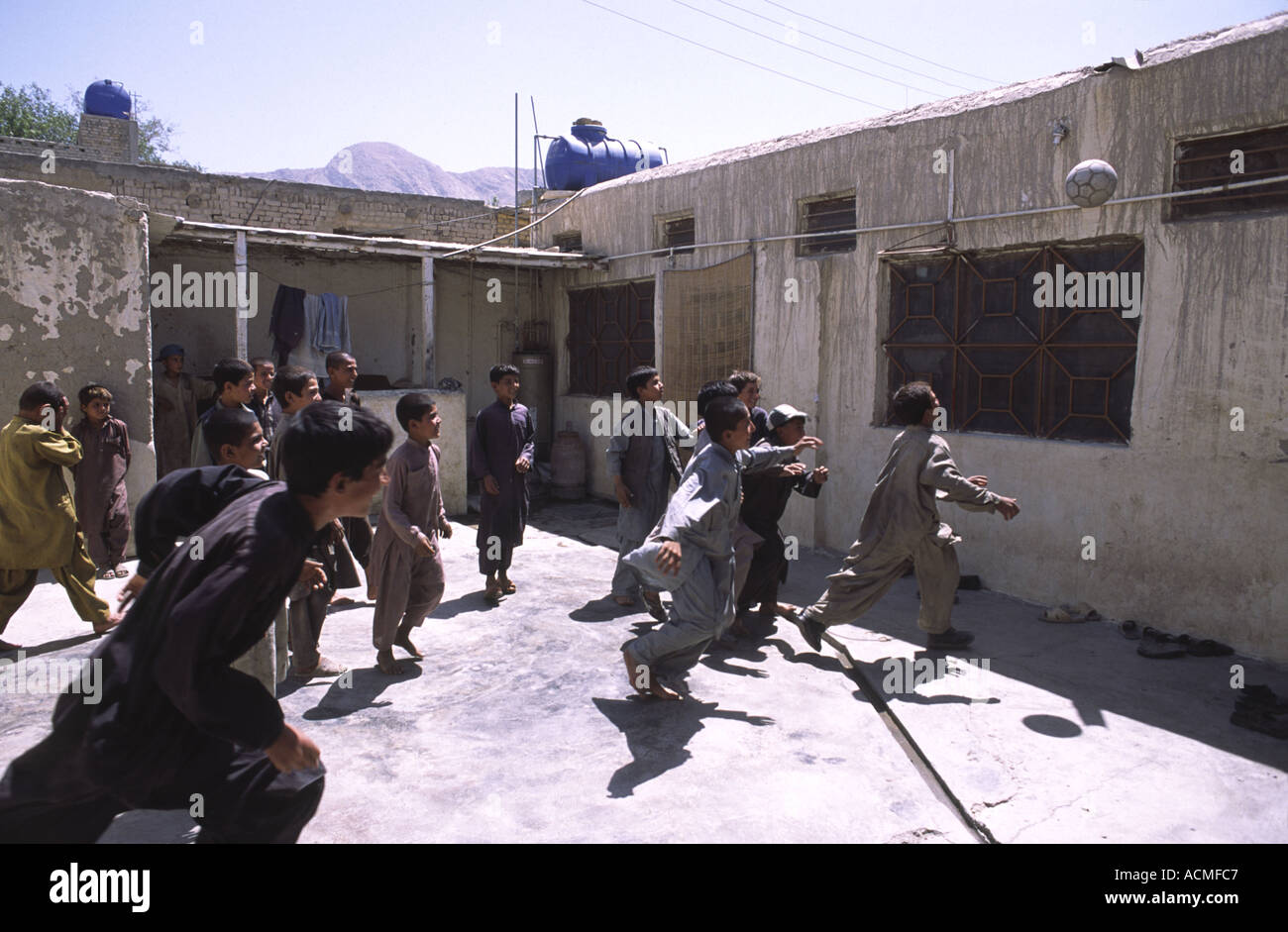Afghan refugee boys playing at an NGO funded drop in centre in Quetta ...