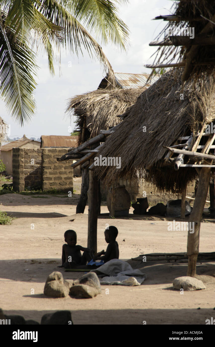Children playing under thatch hut in village Togo West Africa Stock ...