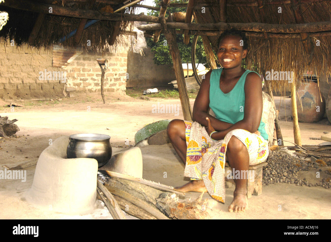 Ewe woman cooking on traditional fire place Akame Togo Stock Photo - Alamy